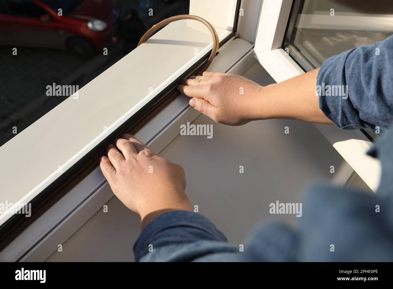 Worker putting tape on hi-res stock photography and images - Alamy