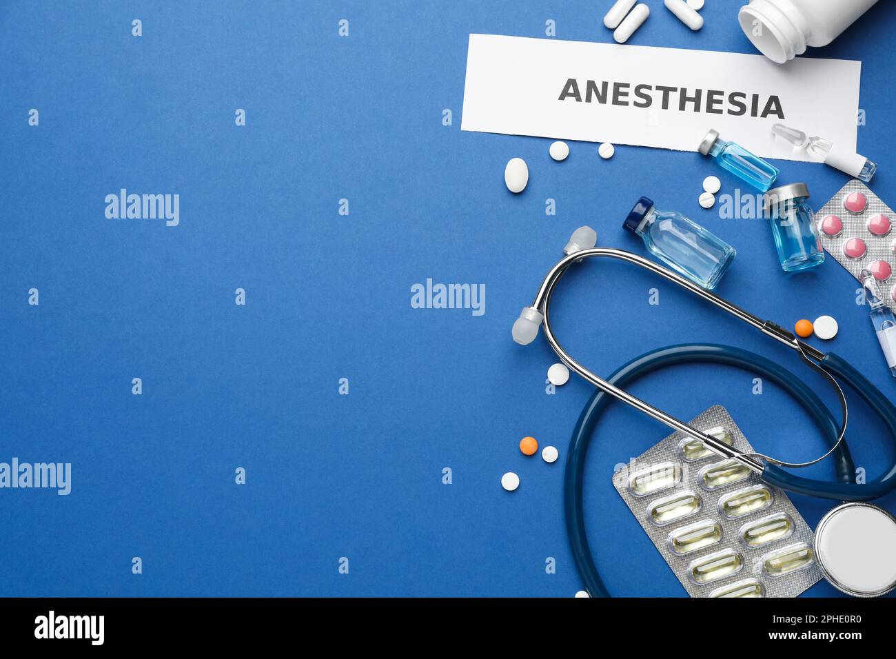 Flat lay composition with word Anesthesia and drugs on blue background ...