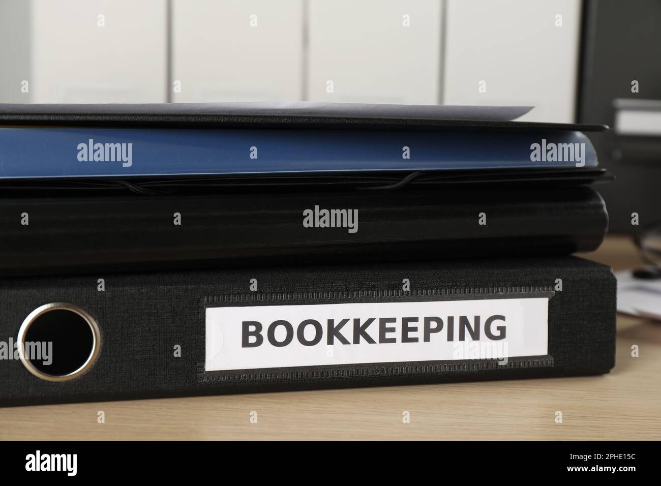 Stack of folders on desk in office, closeup. Bookkeeper's workplace ...