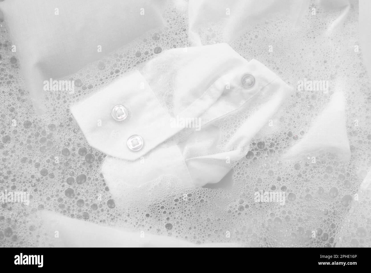 White garment in suds, closeup. Hand washing laundry Stock Photo - Alamy
