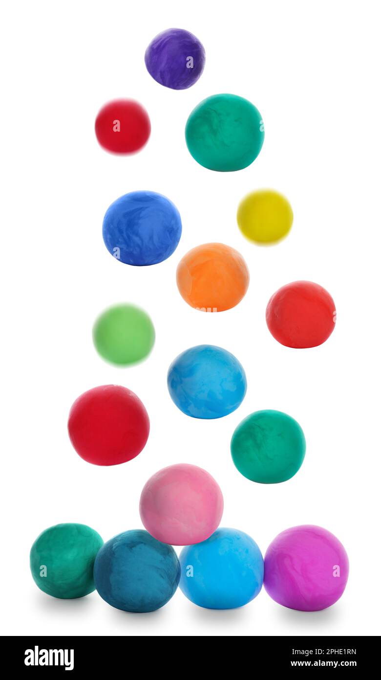 Different colorful play dough falling on white background Stock Photo ...