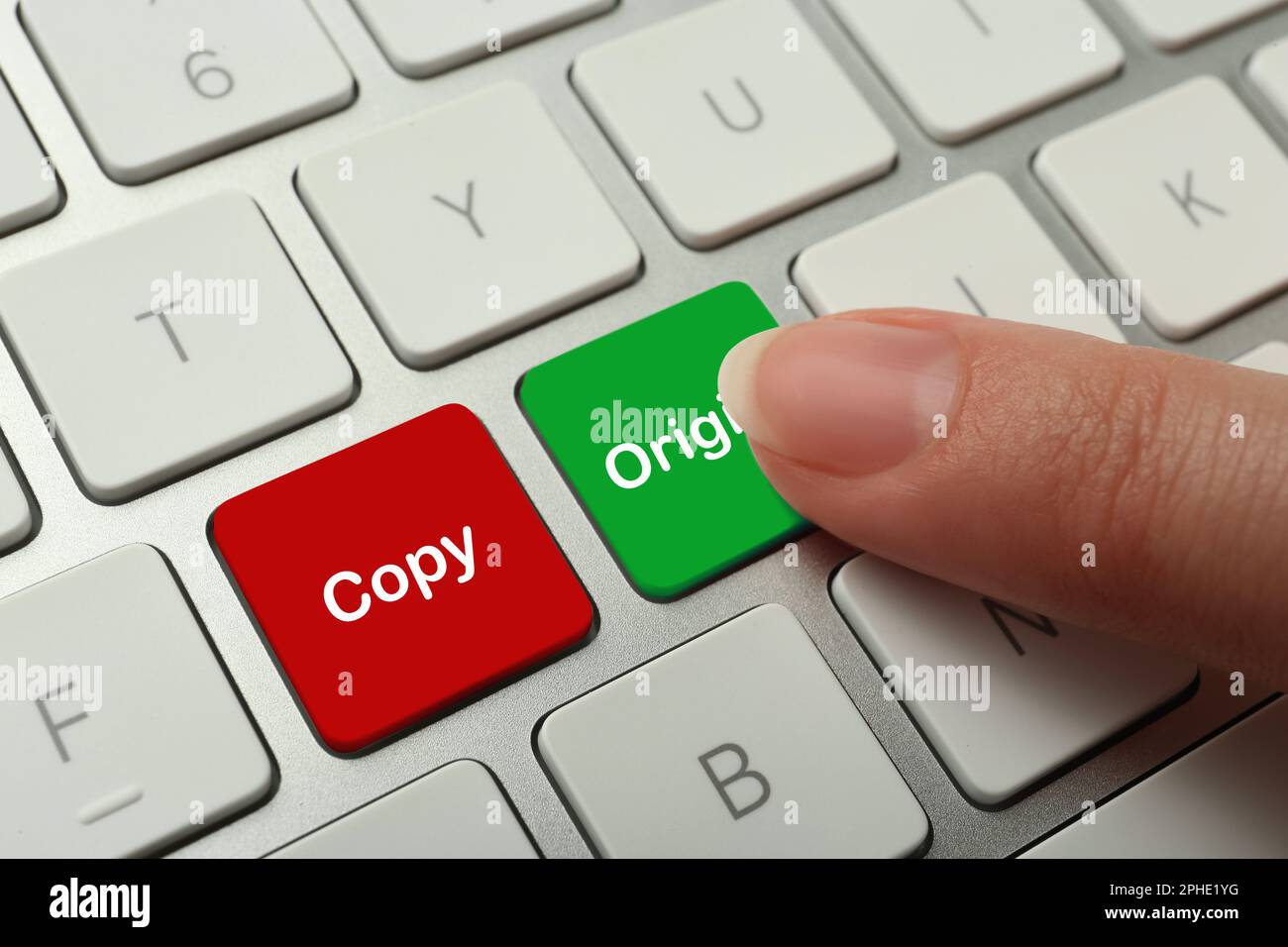 Woman pressing green button with word Original on computer keyboard ...