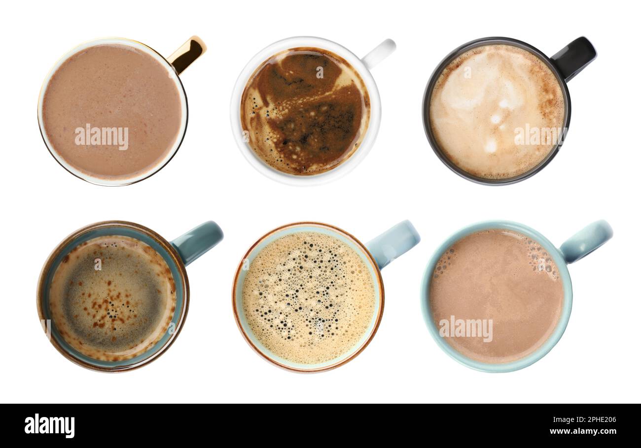 Set of mugs with tasty hot drinks on white background, top view Stock ...