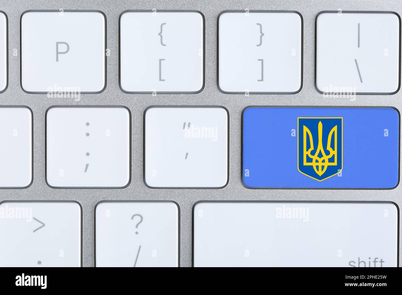 Blue button with Ukrainian coat of arms on keyboard, top view Stock ...