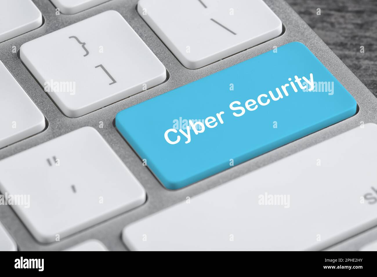 Turquoise button with phrase Cyber Security on keyboard, closeup view ...