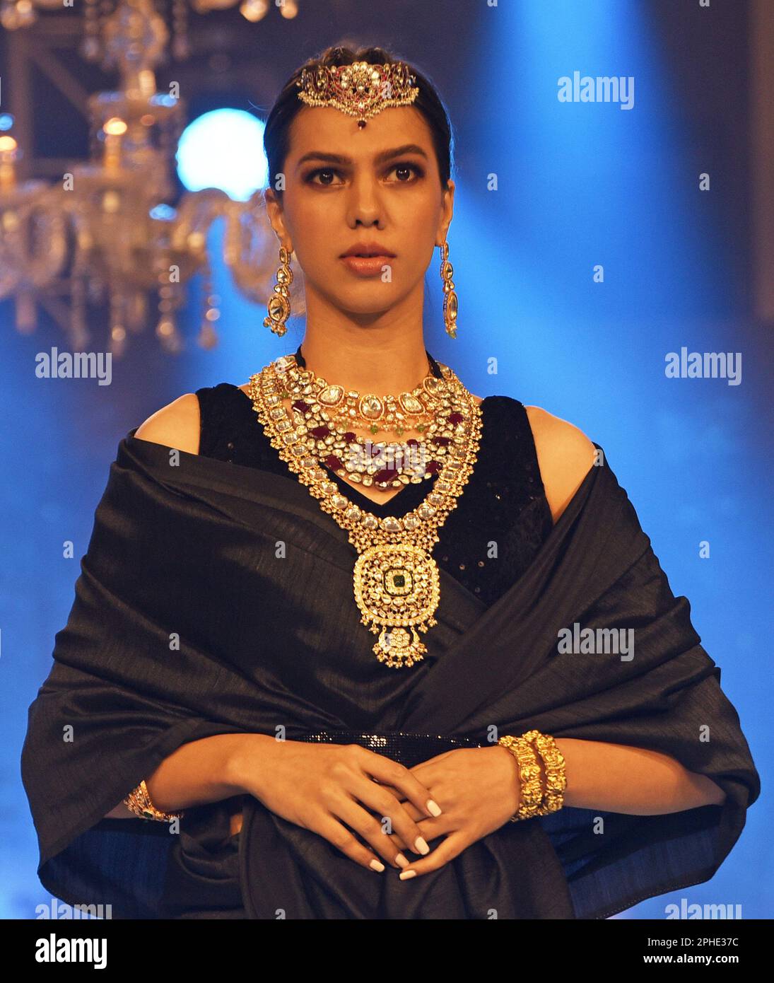 Mumbai, India. 27th Mar, 2023. A model wearing jewellery poses for a ...