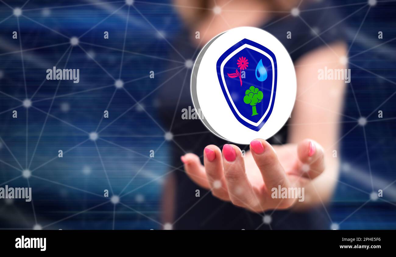 Nature protection concept above the hand of a woman in background Stock ...