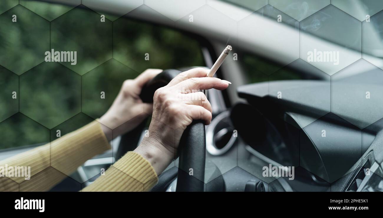 Woman smoking cigarette driving hi-res stock photography and images - Alamy