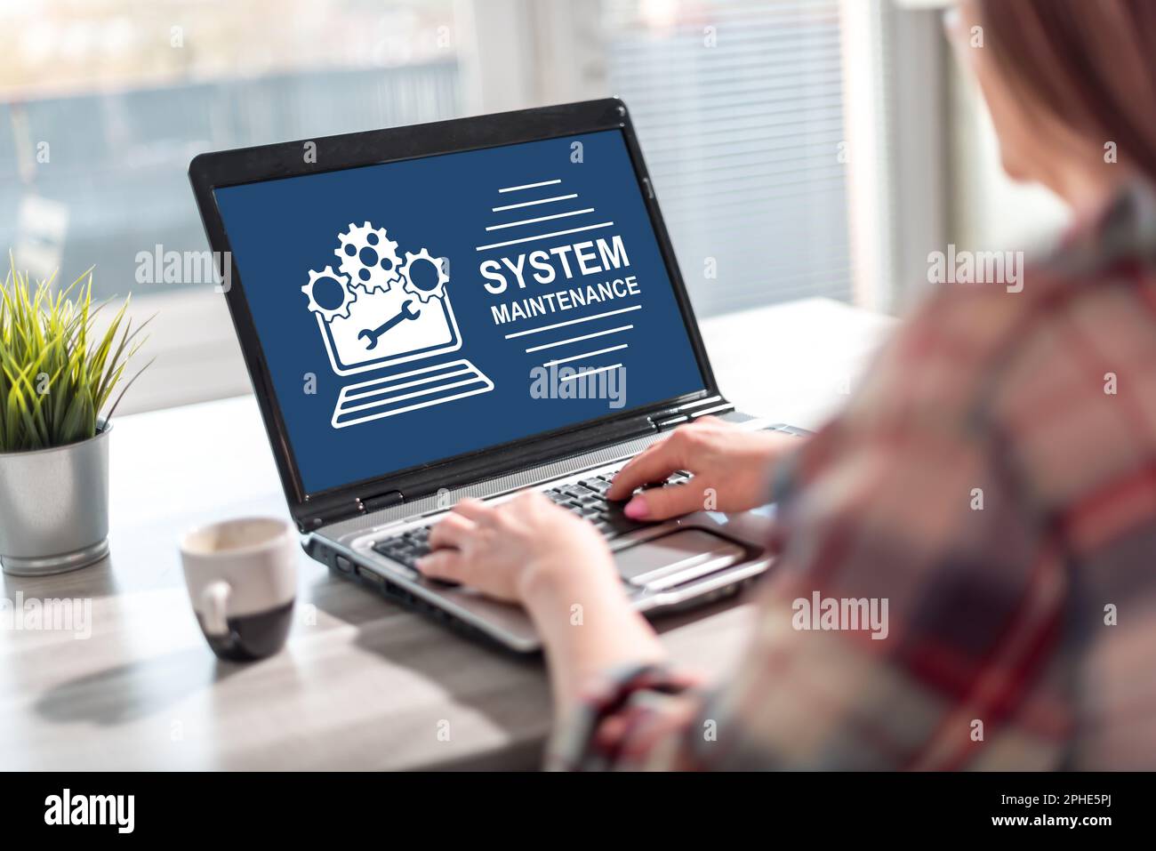 Laptop screen displaying a system maintenance concept Stock Photo - Alamy