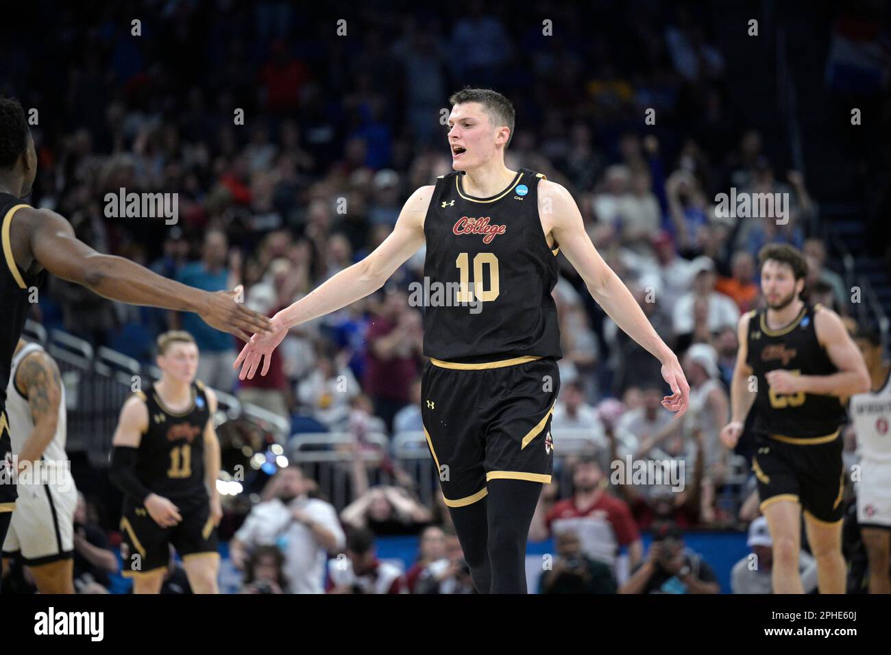 Charleston forward Ante Brzovic (10) reacts after scoring during the ...