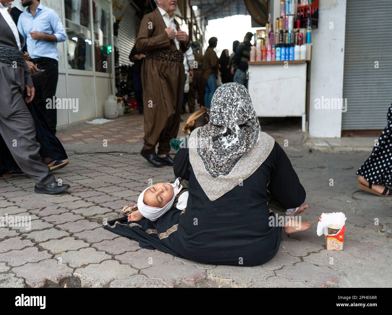 A mother in Iraqi Kurdistan risks her child's life to earn money on the ...