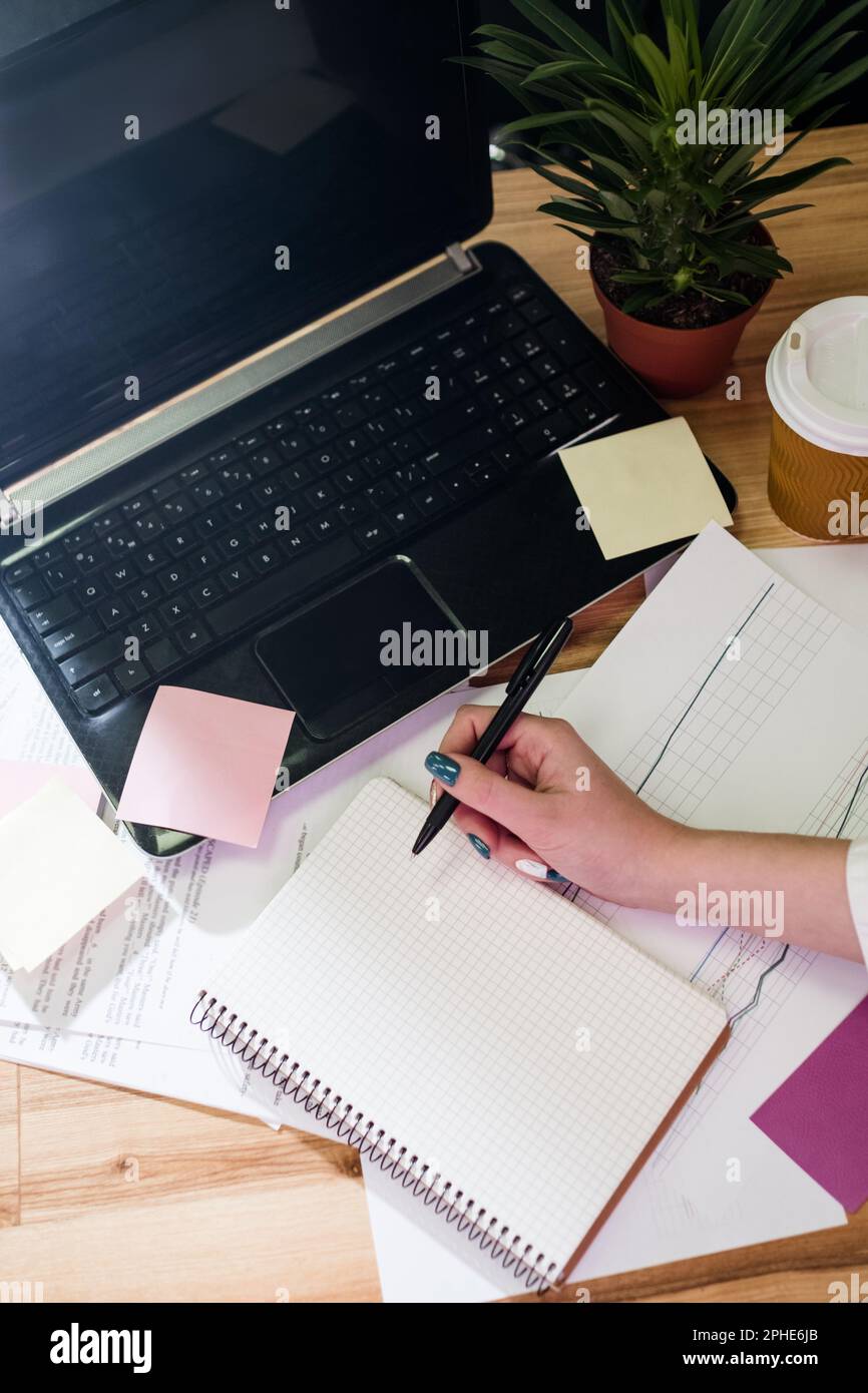 workplace clutter creative chaos paper office desk Stock Photo - Alamy