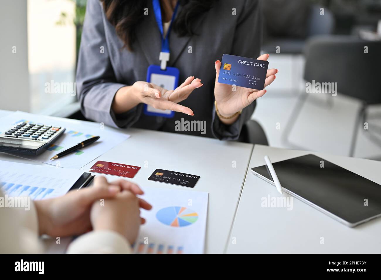 Close-up image of a professional female banker explaining the ...