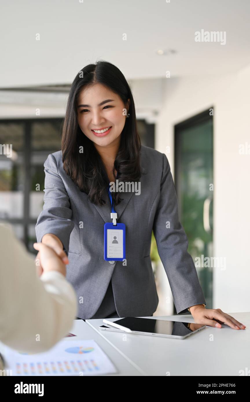 Portrait, Attractive millennial Asian businesswoman or female banker ...