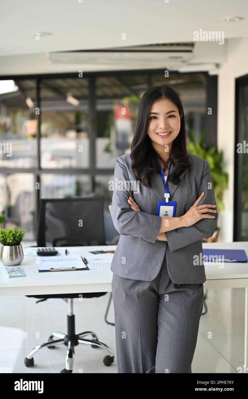 Portrait of a confident and successful millennial Asian businesswoman or female manager in ...