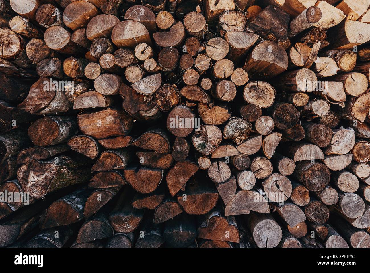 Pile of chopped stacked firewood in home backyard as background and ...