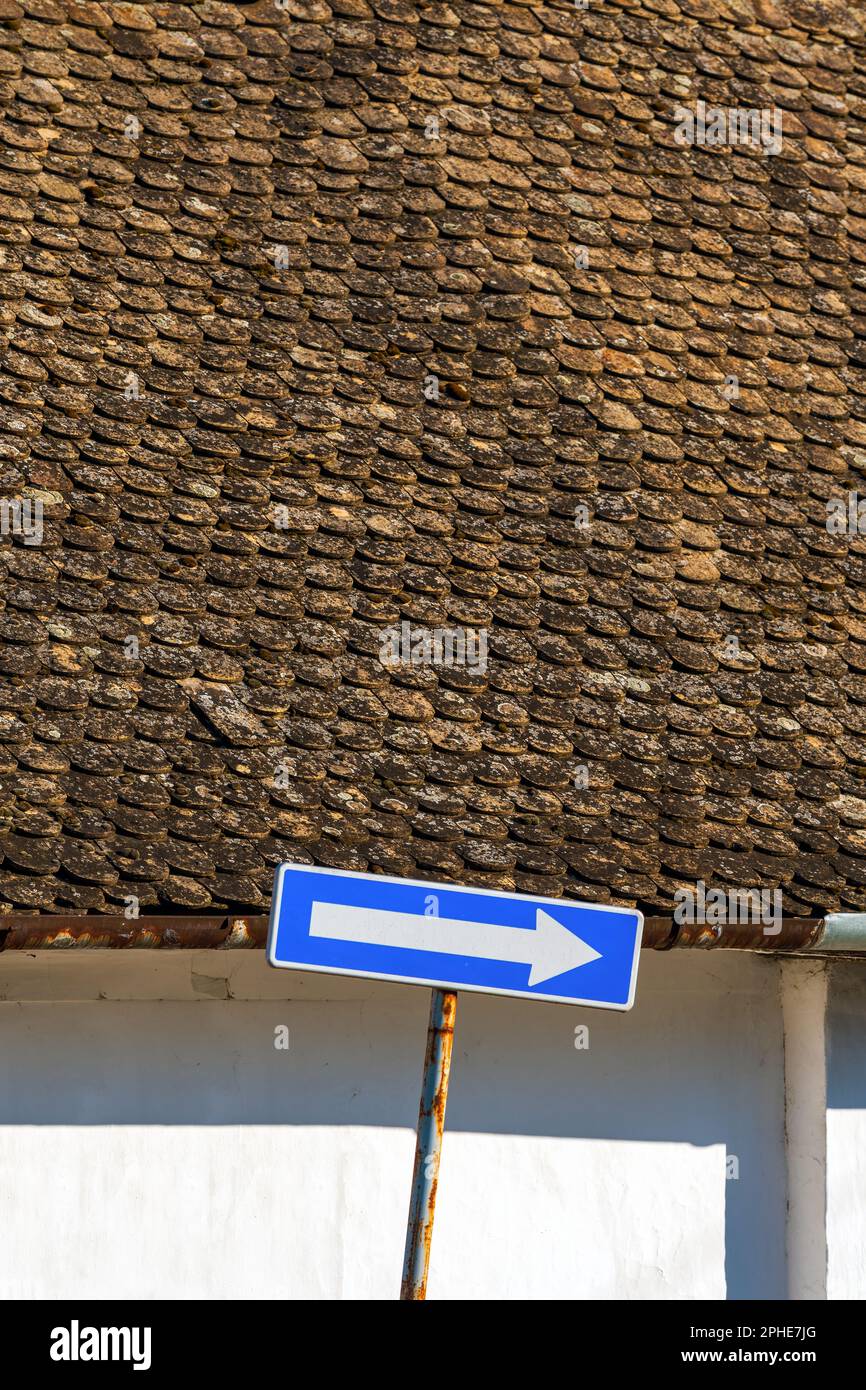 Blue traffic sign white arrow hi-res stock photography and images - Alamy