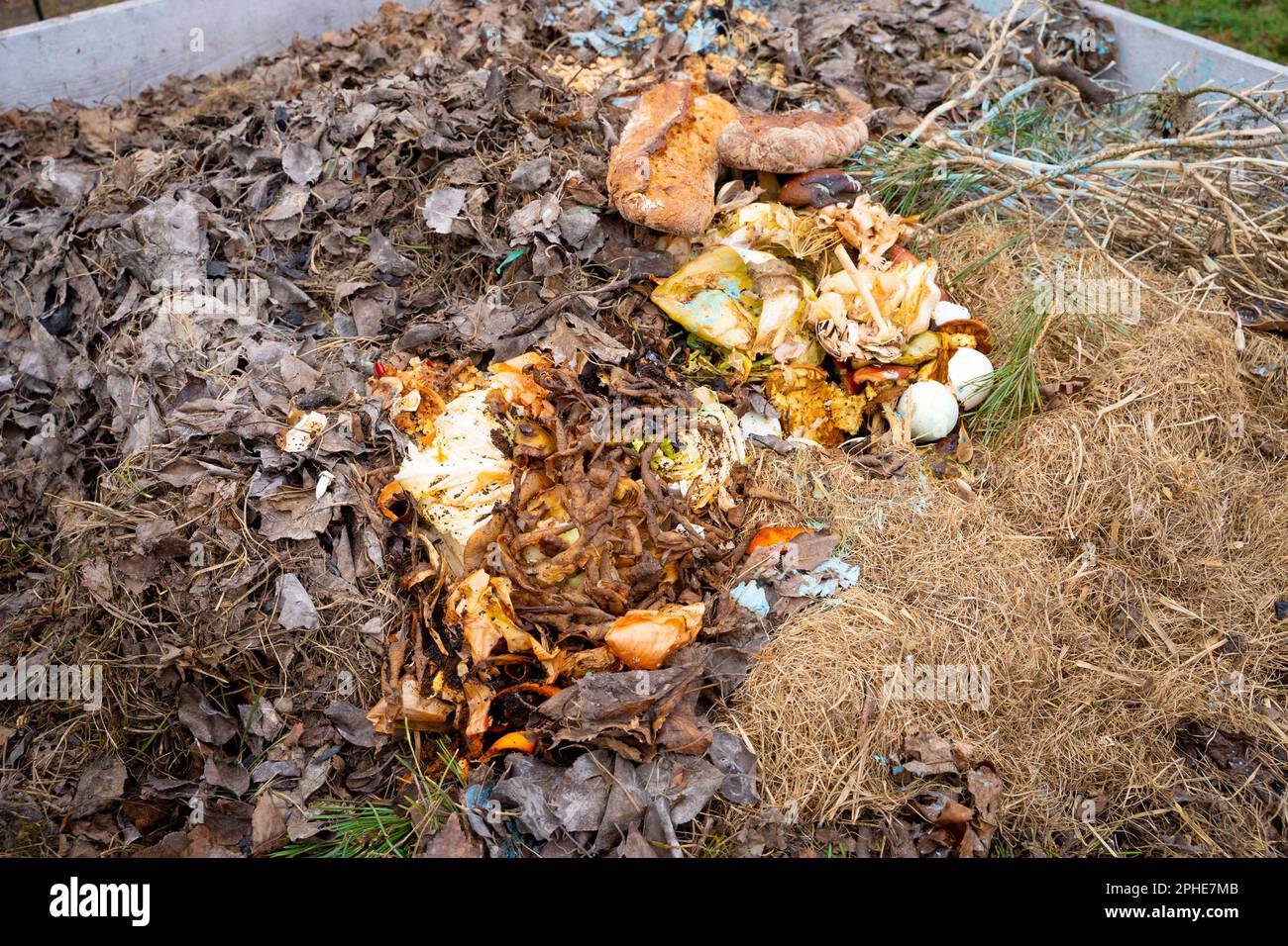 Compost heap after winter close-up. Organic waste to be converted into ...