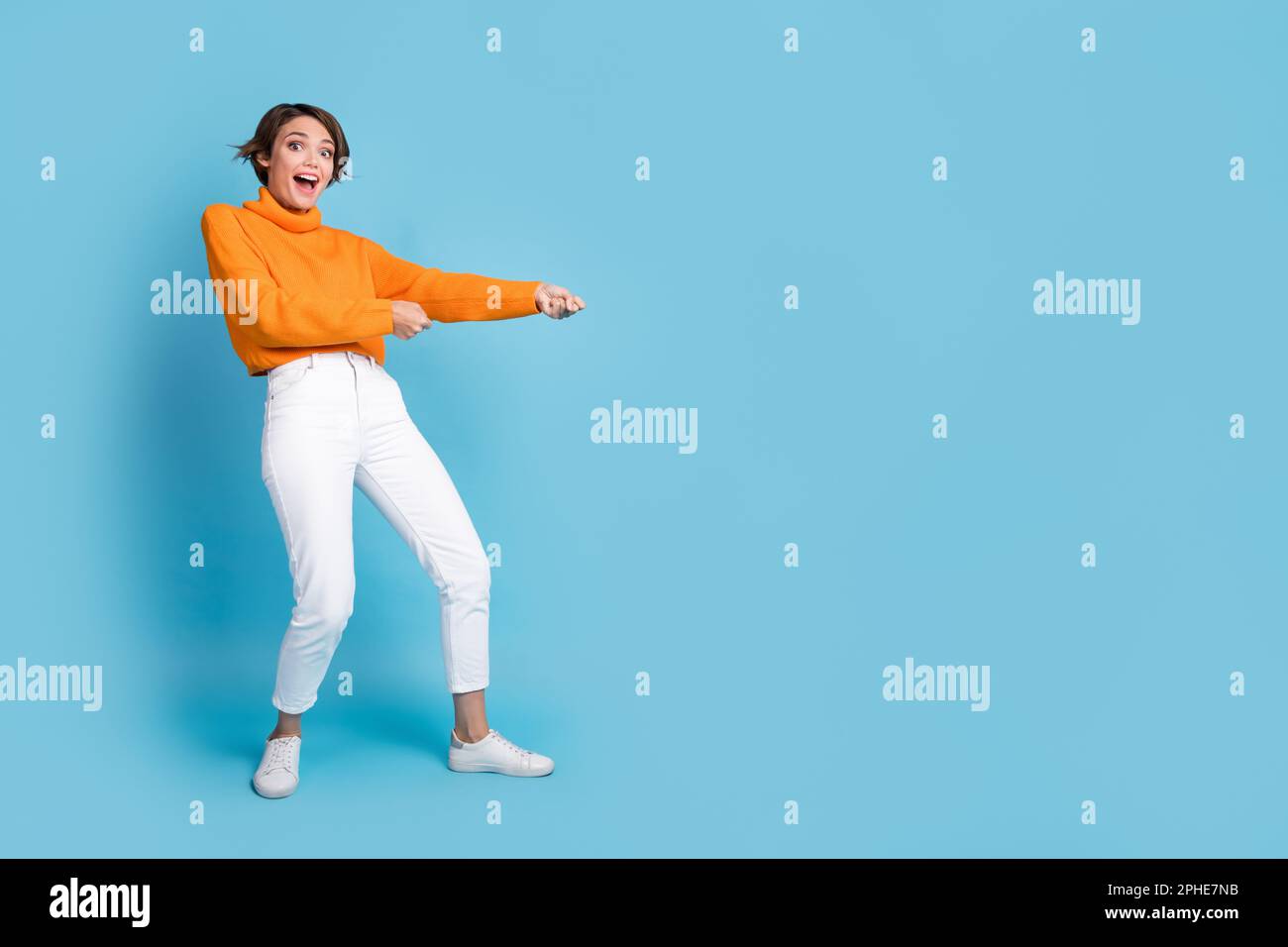 Full size photo of pretty young girl pulling rope string excited empty ...