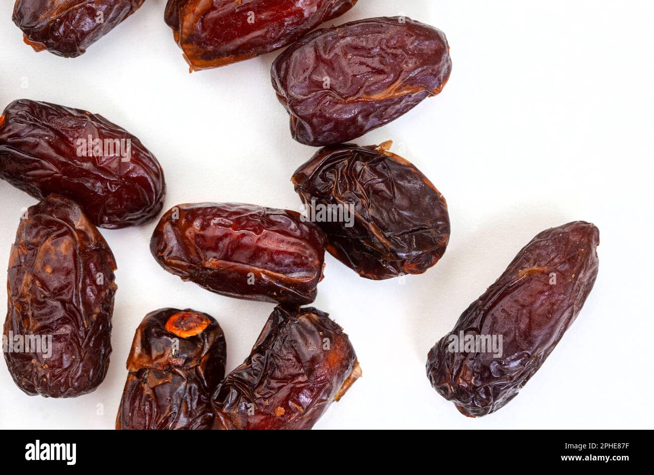 Delicious, dried dates isolated on white background Stock Photo - Alamy