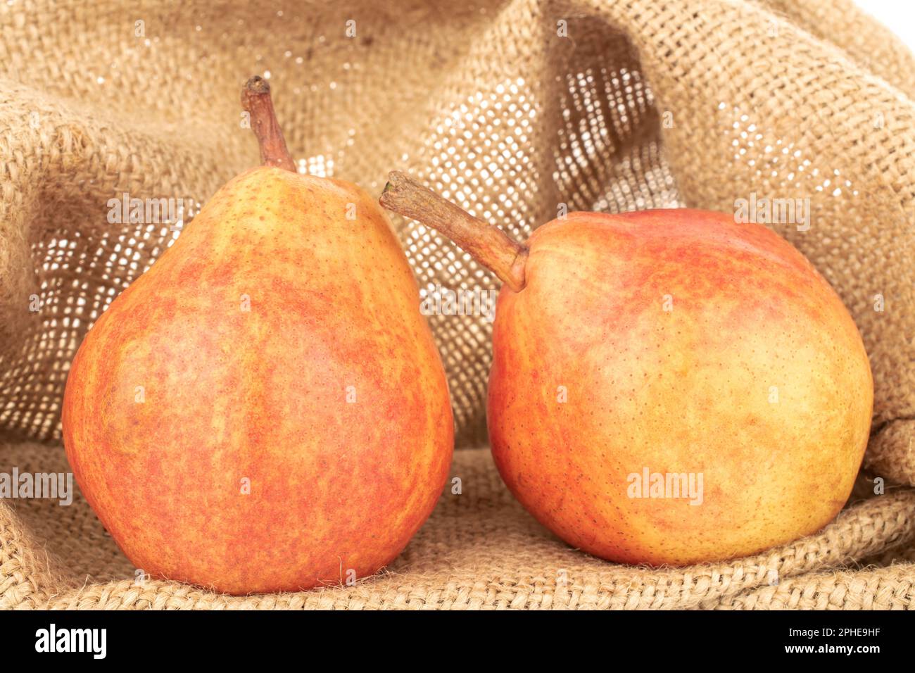 Two organic Bartlett pears with jute bag, macro Stock Photo - Alamy