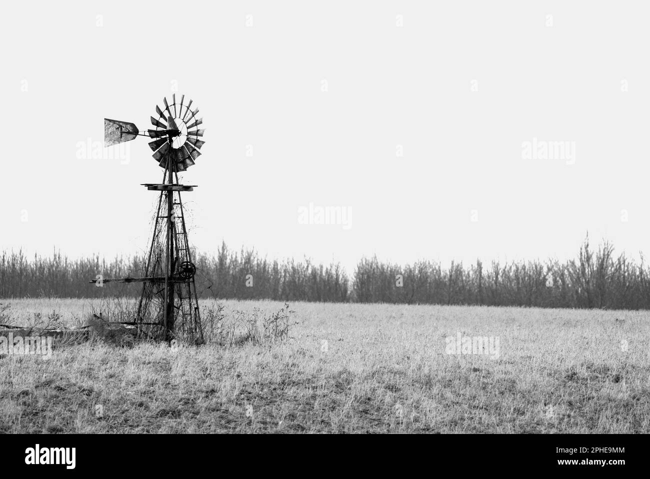 A single windmill standing in an open field Stock Photo - Alamy