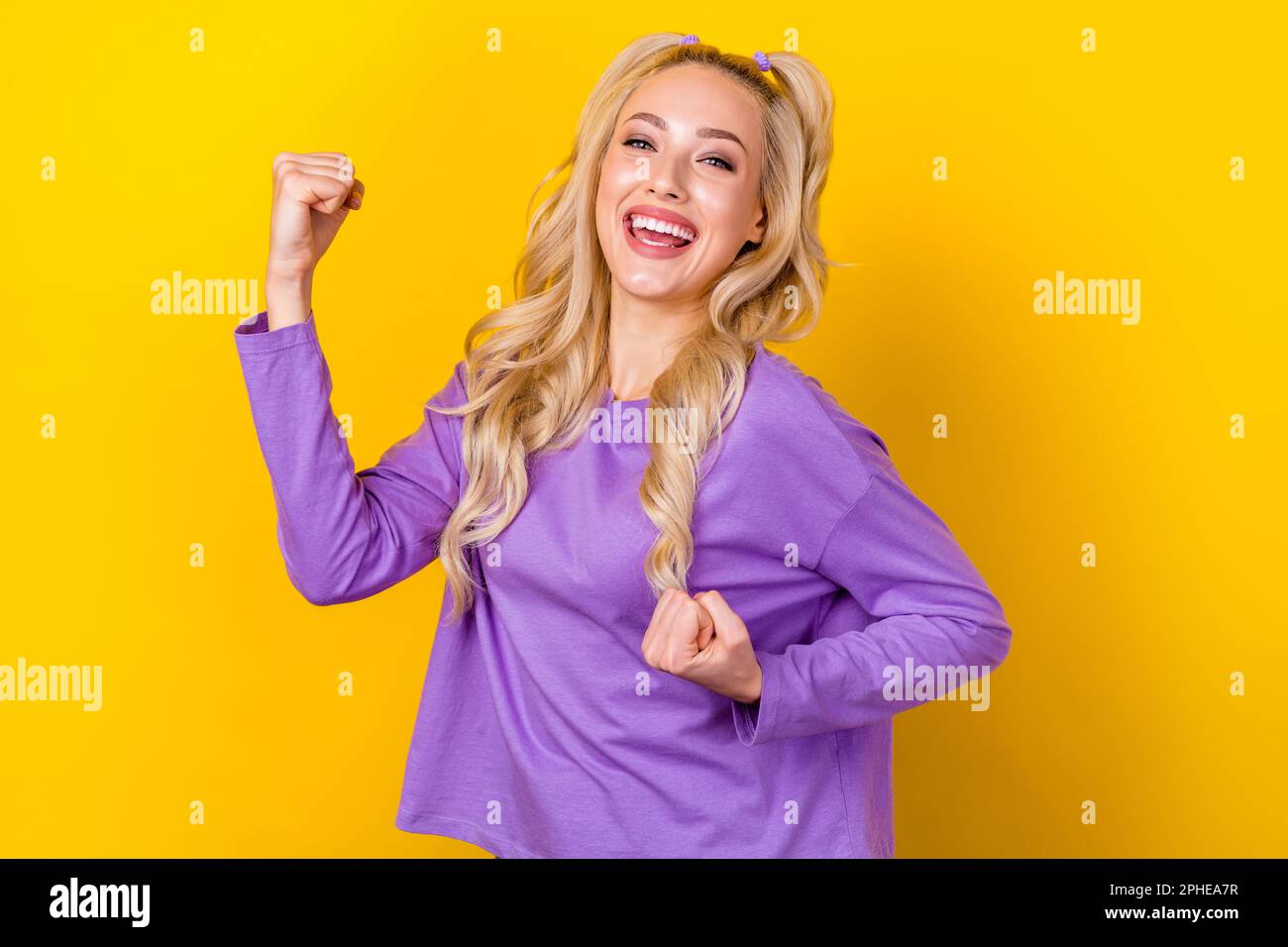 Photo portrait of attractive young woman raise fists celebrate luck win ...