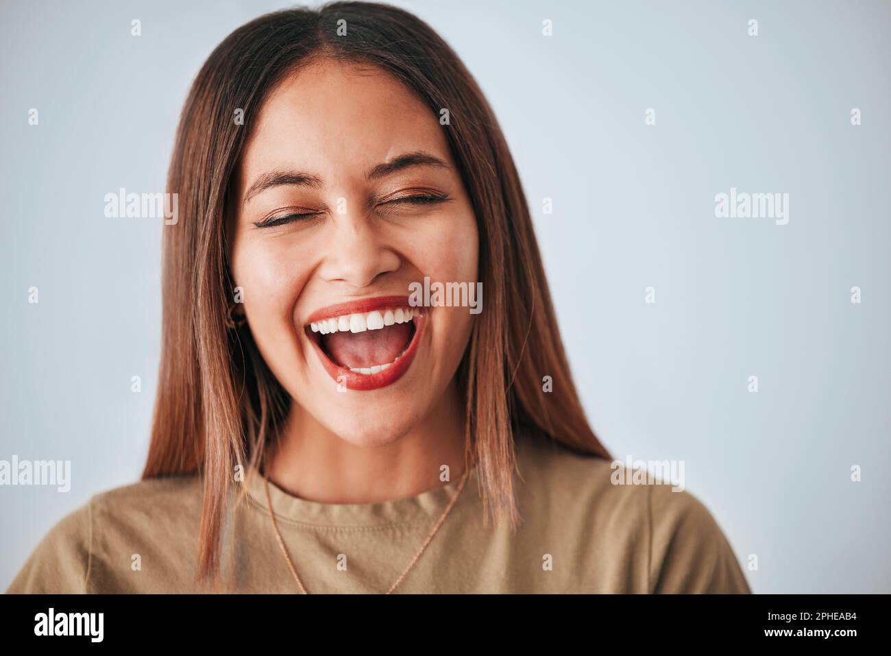 Woman is laughing, happiness and face with freedom isolated on studio ...