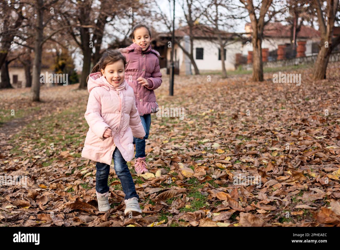 Autumn girls park with happy children with people outdoors hi-res stock ...