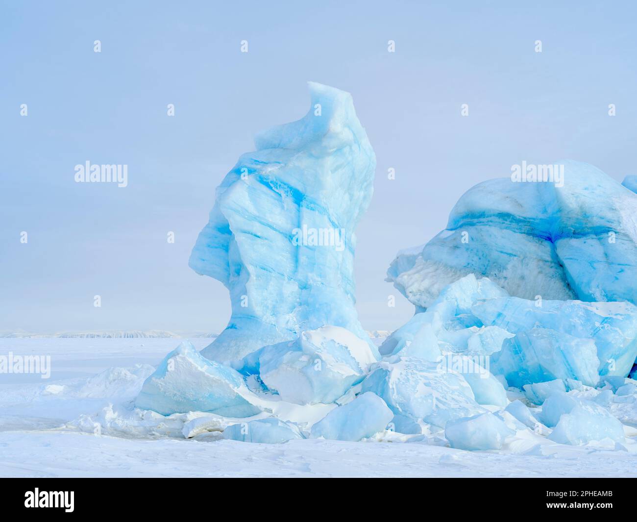 Iceberg in the frozen Mohnbukta in Sabine-Land. The island Spitzbergen ...