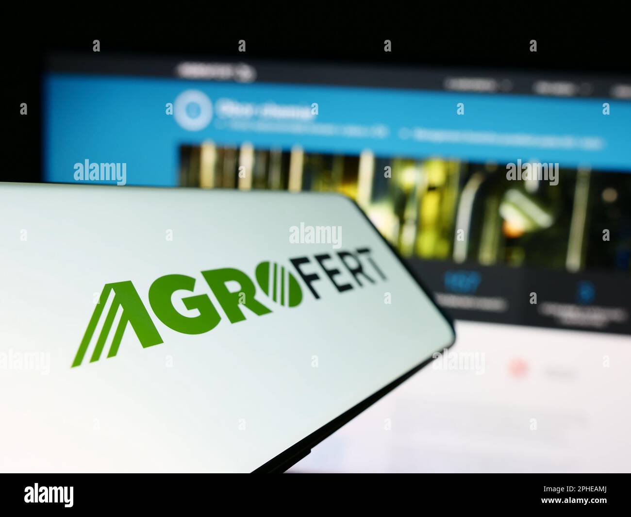 Mobile phone with logo of Czech company Agrofert a.s. on screen in ...