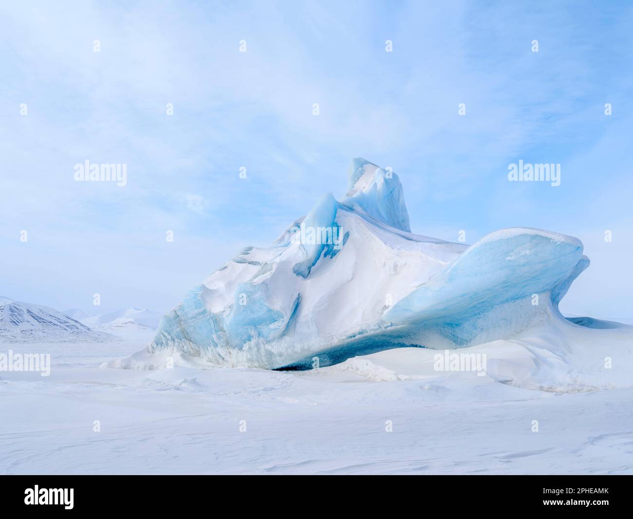 Iceberg in the frozen Mohnbukta in Sabine-Land. The island Spitzbergen ...