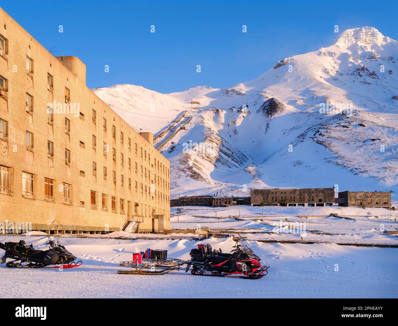 Snowmobiles and visitors. Pyramiden, abandoned russian mining ...