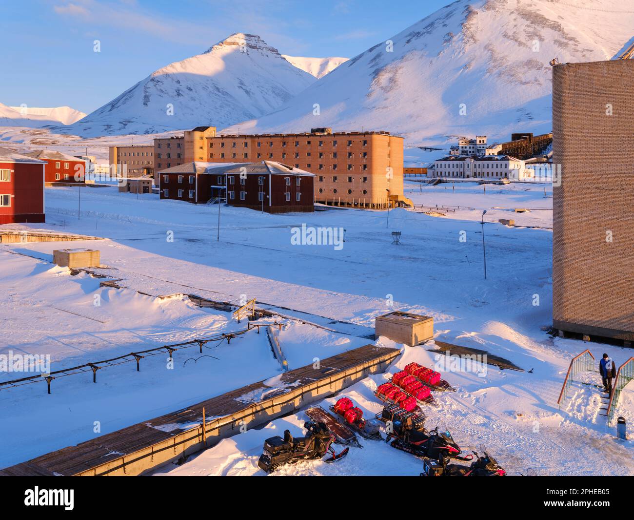 Snowmobiles and visitors. Pyramiden, abandoned russian mining ...