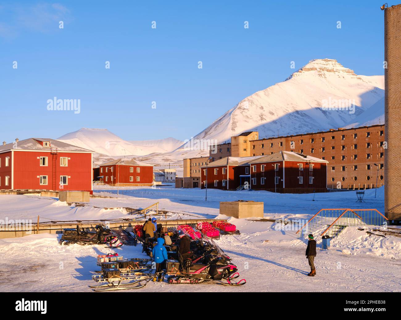 Snowmobiles and visitors. Pyramiden, abandoned russian mining ...