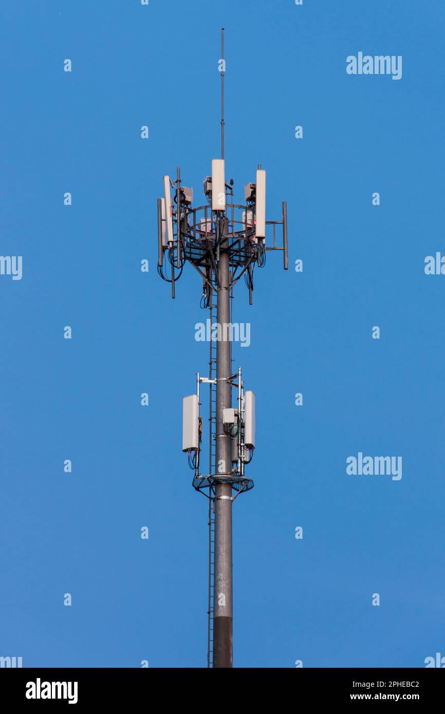 An aerial view of a cellular antenna mounted on the rooftop of a ...