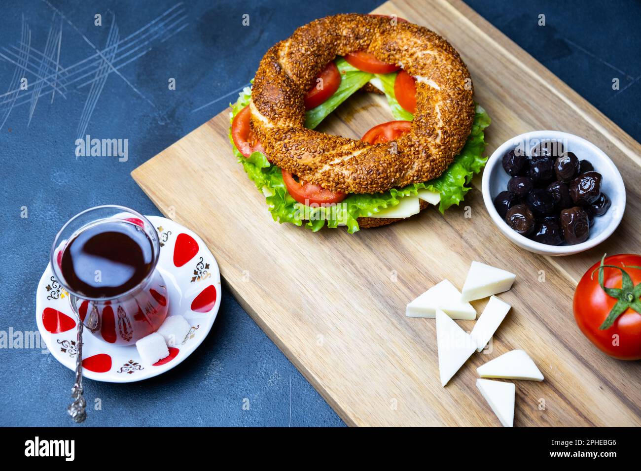 Traditional Turkish breakfast olives, bagel, cheese, tea, top view ...