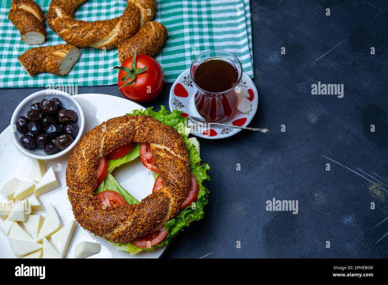 Traditional Turkish breakfast olives, bagel, cheese, tea, top view ...