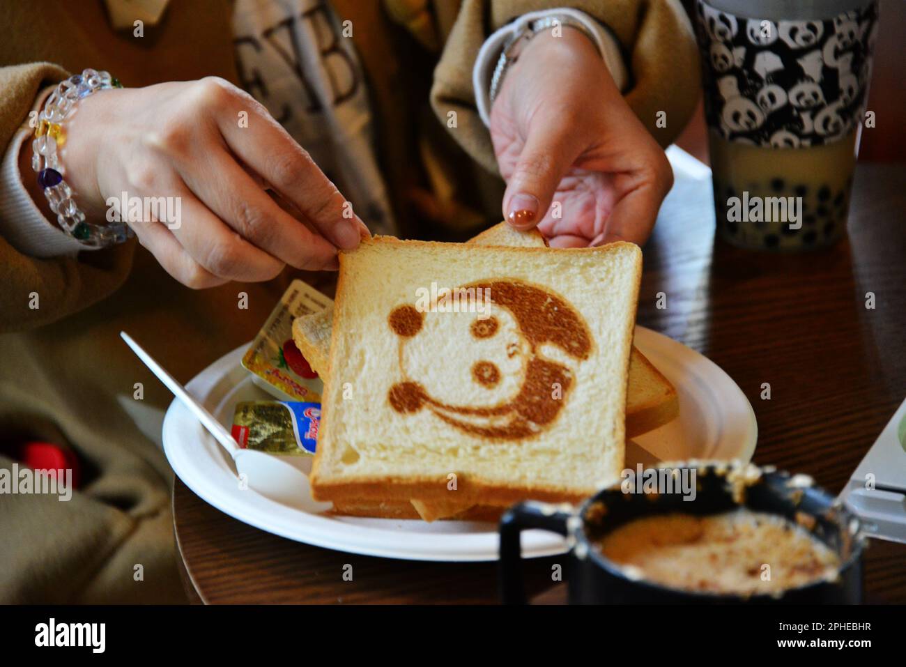 BEIJING, CHINA - MARCH 28, 2023 - Young people eat at the Panda Cafe on ...