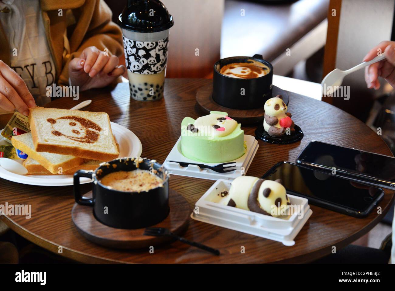 BEIJING, CHINA - MARCH 28, 2023 - Young people eat at the Panda Cafe on the second floor of the ...