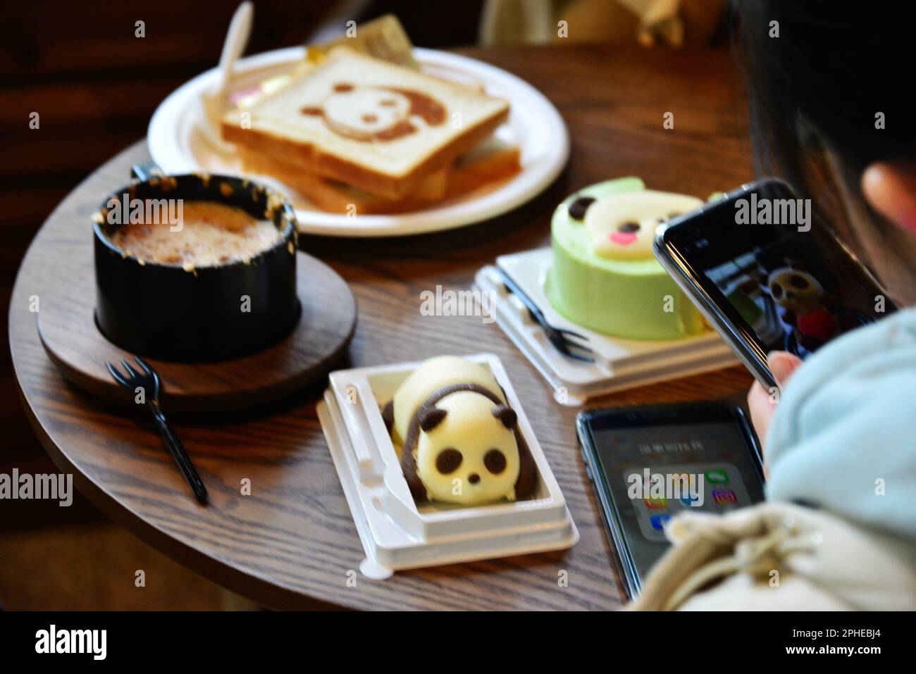 BEIJING, CHINA - MARCH 28, 2023 - Young people eat at the Panda Cafe on ...