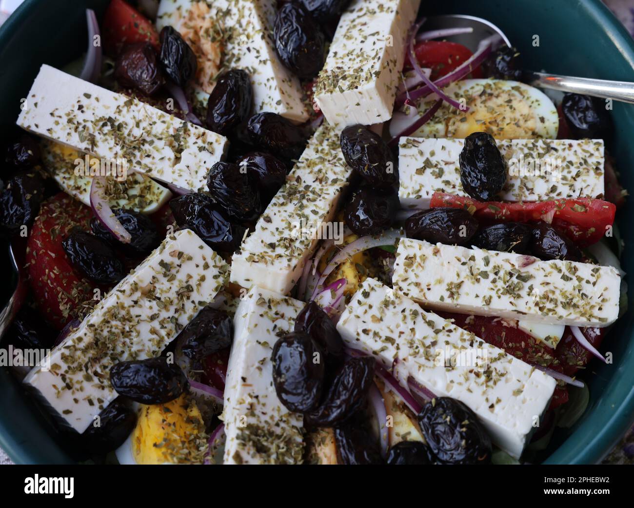 Greek salad with feta cheese and black olives. Typical delicious greek ...