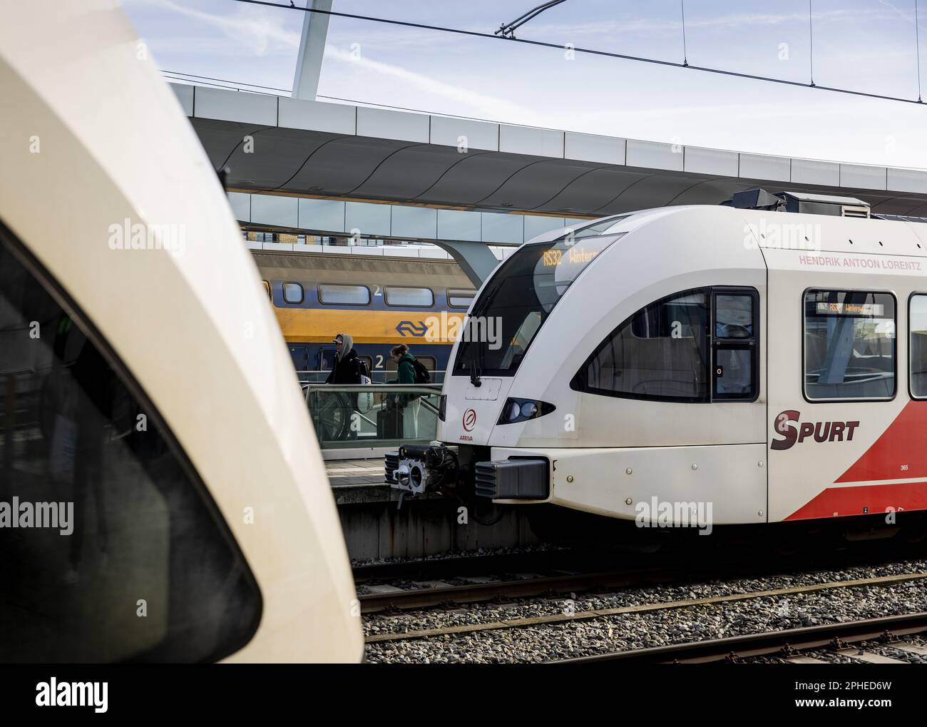 ARNHEM - Arriva trains next to a NS train. Rail transporter Arriva is ...