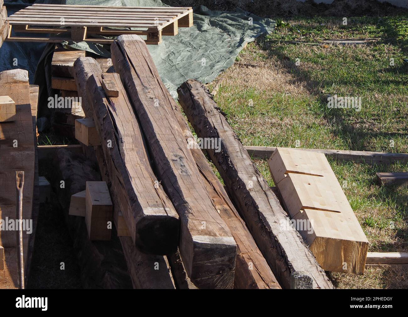 wooden logs and beams in a construction site Stock Photo - Alamy