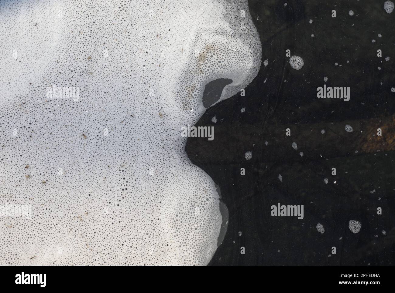detergent foam pollution floating on a polluted river Stock Photo - Alamy