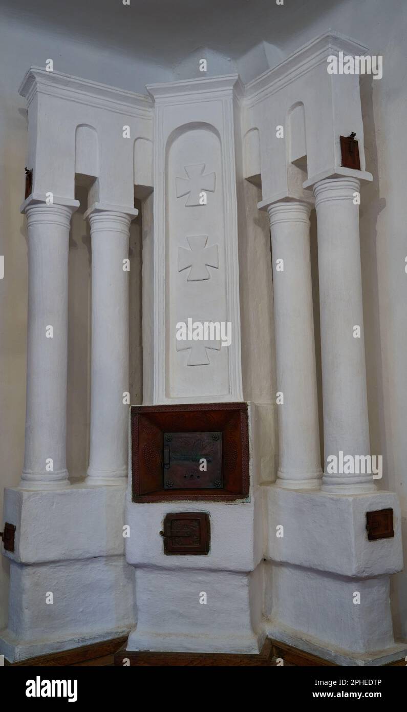 Ancient medieval heater and fireplace with pipes and bronze door Stock ...