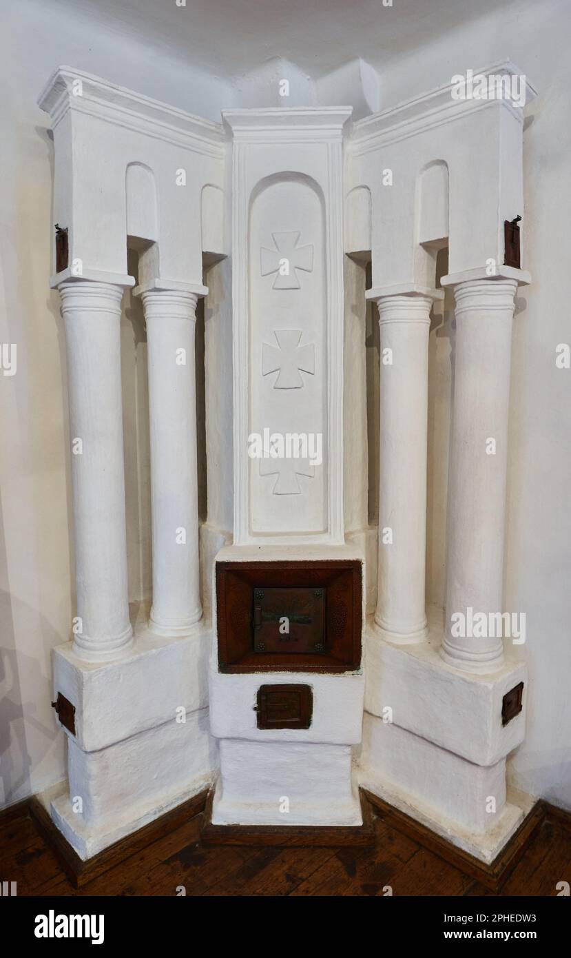 Ancient medieval heater and fireplace with pipes and bronze door Stock ...