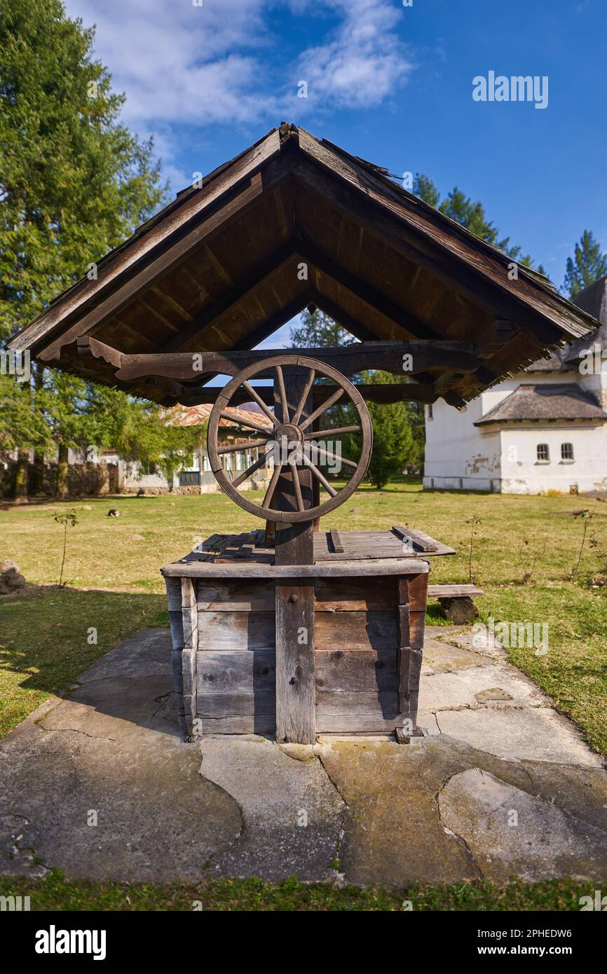 Vintage wooden well with shingle roof in the countryside Stock Photo ...