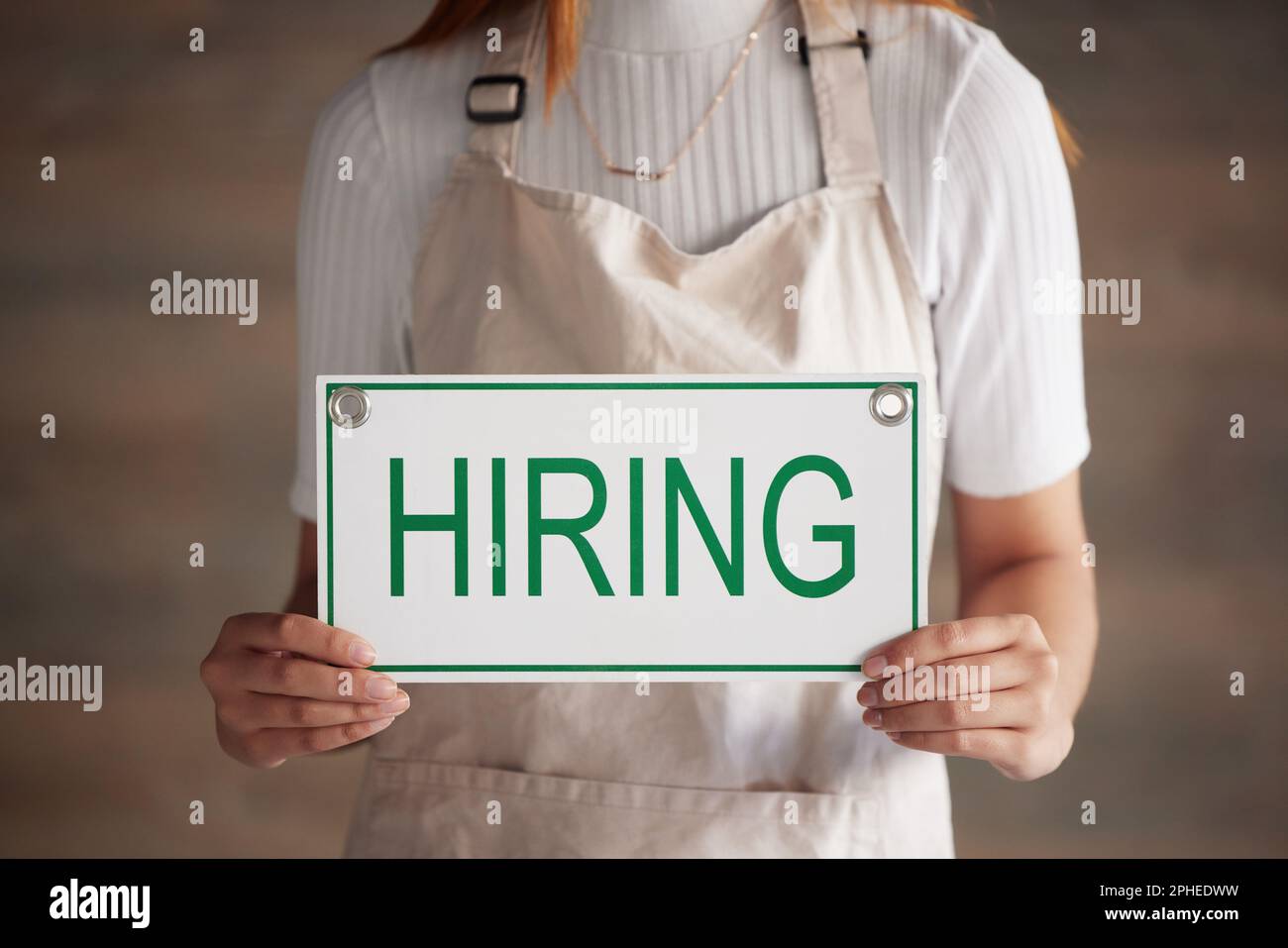 Woman, hands and hiring sign for small business recruitment, career or ...