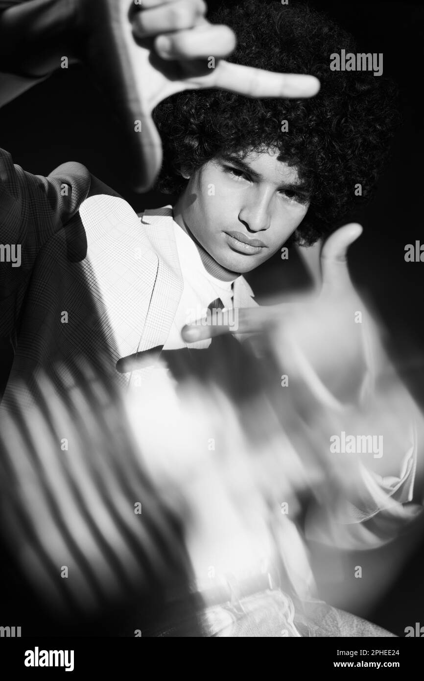 Black and white of young Hispanic male model with Afro hairstyle ...